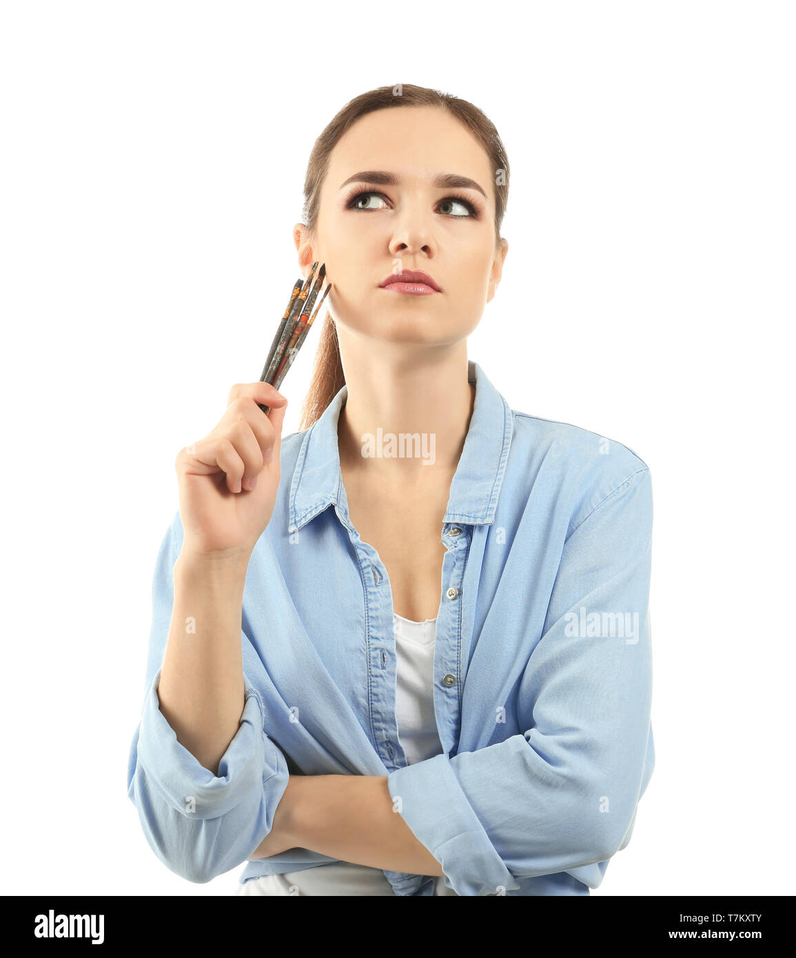 Portrait of thoughtful female artist on white background Stock Photo ...