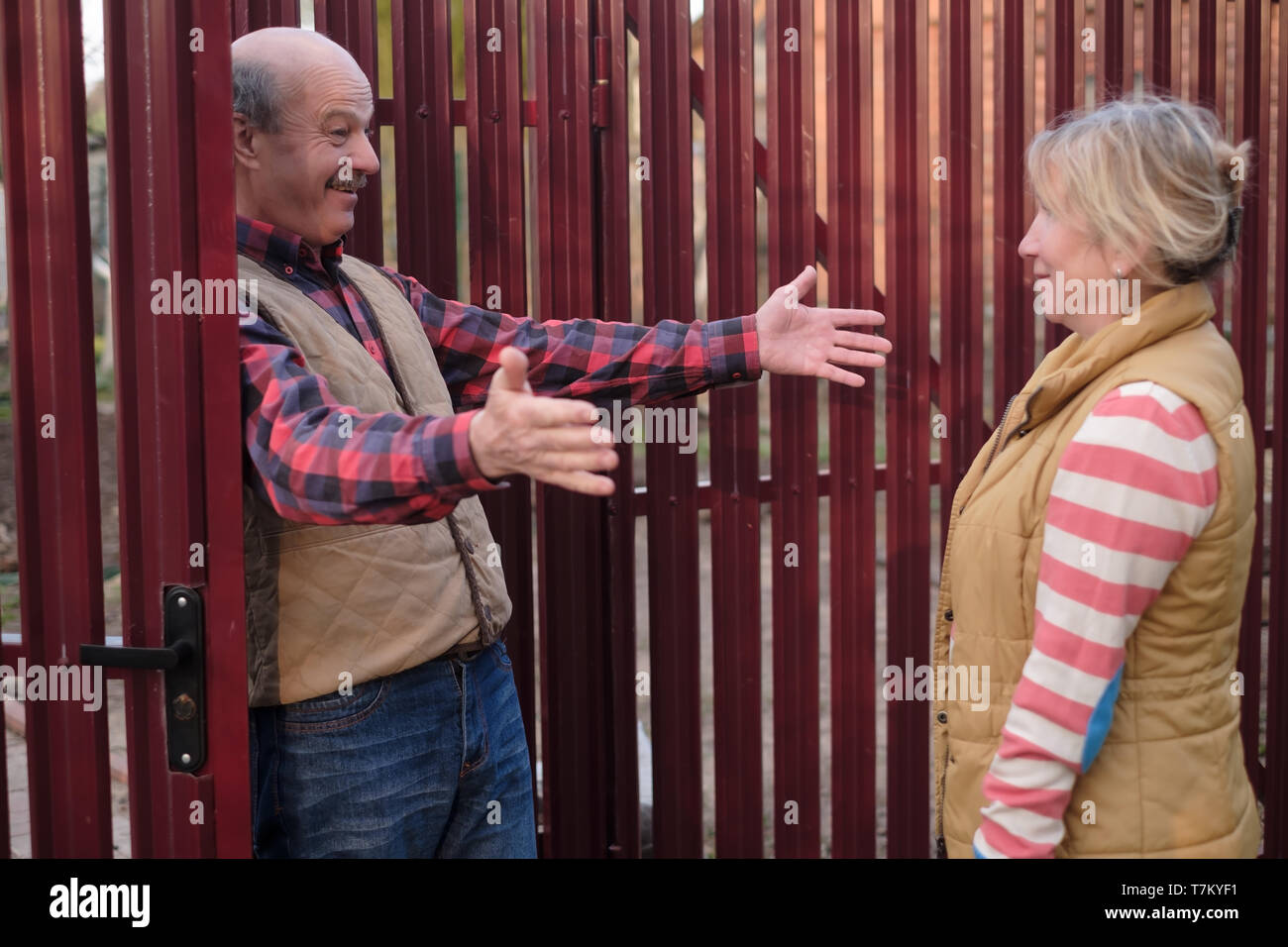 Greeting friends at the door hi-res stock photography and images - Alamy