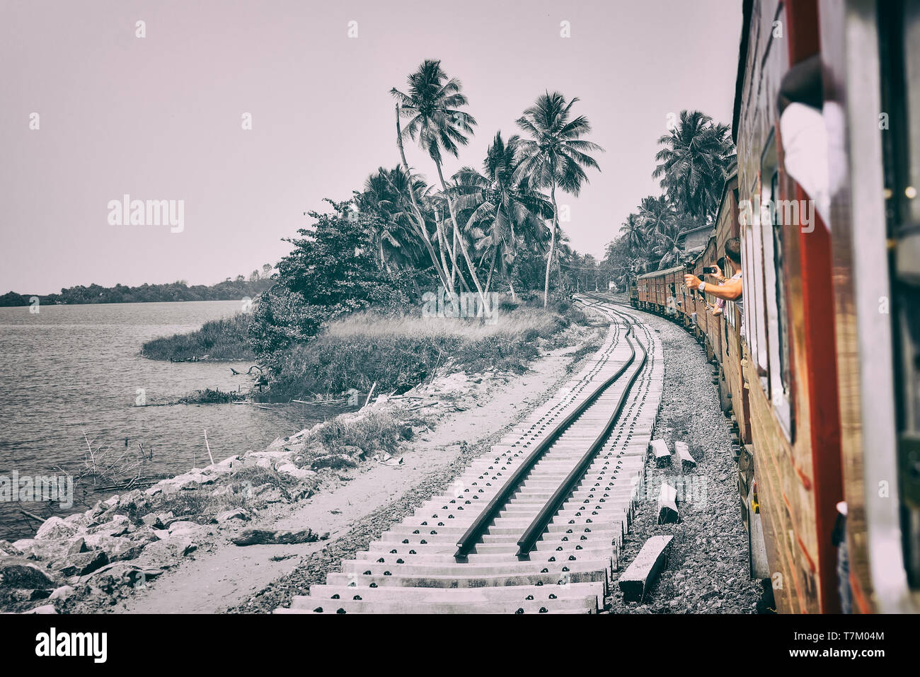 train rides along the the ocean shore Stock Photo - Alamy
