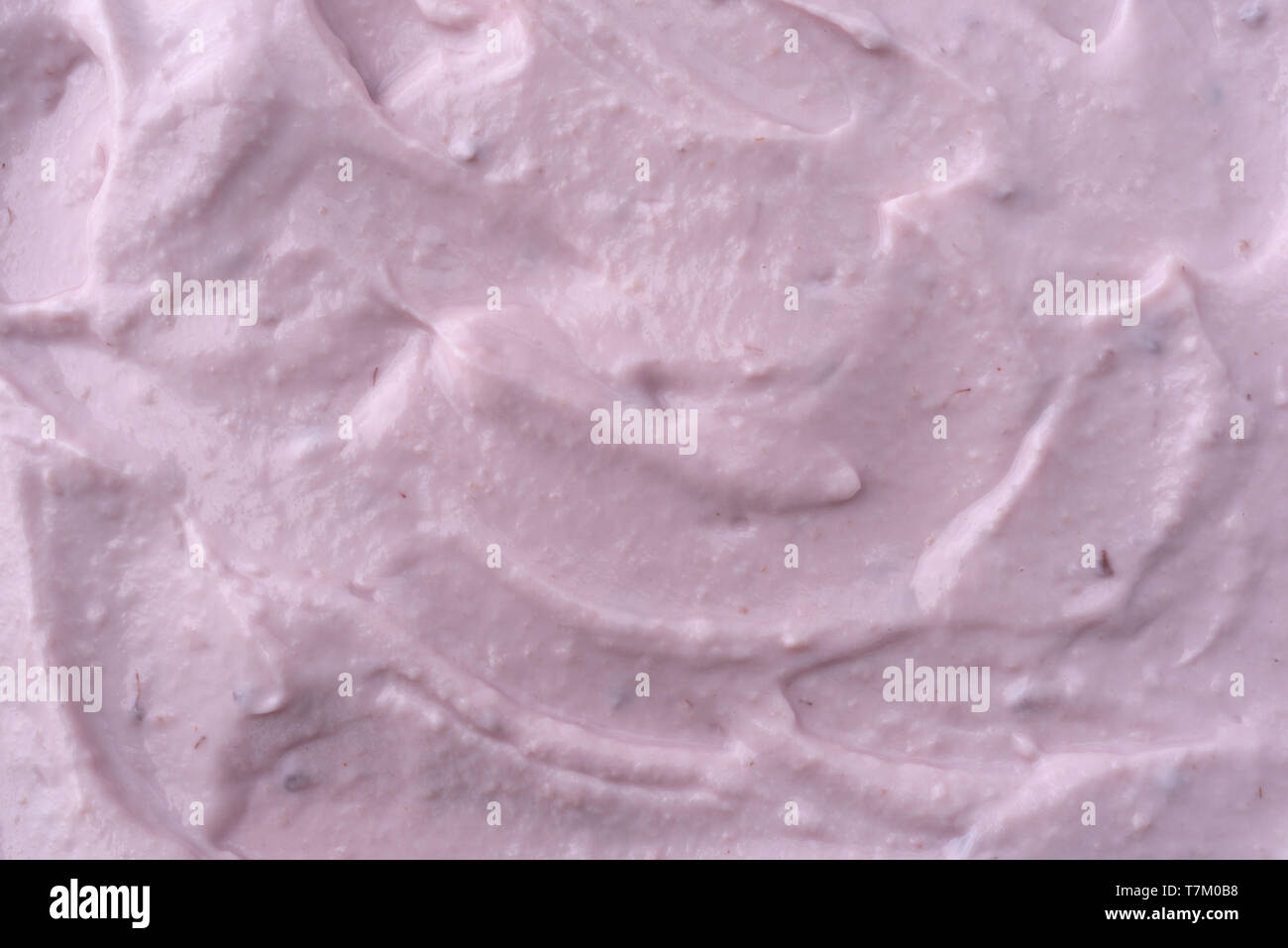 Close view of red raspberry yogurt illuminated with natural light Stock ...