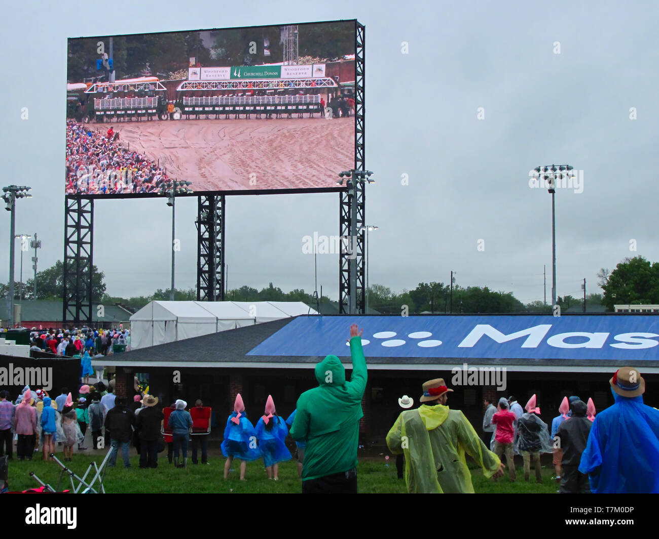 Kentucky Derby People watching final race on teletron at Churchill ...