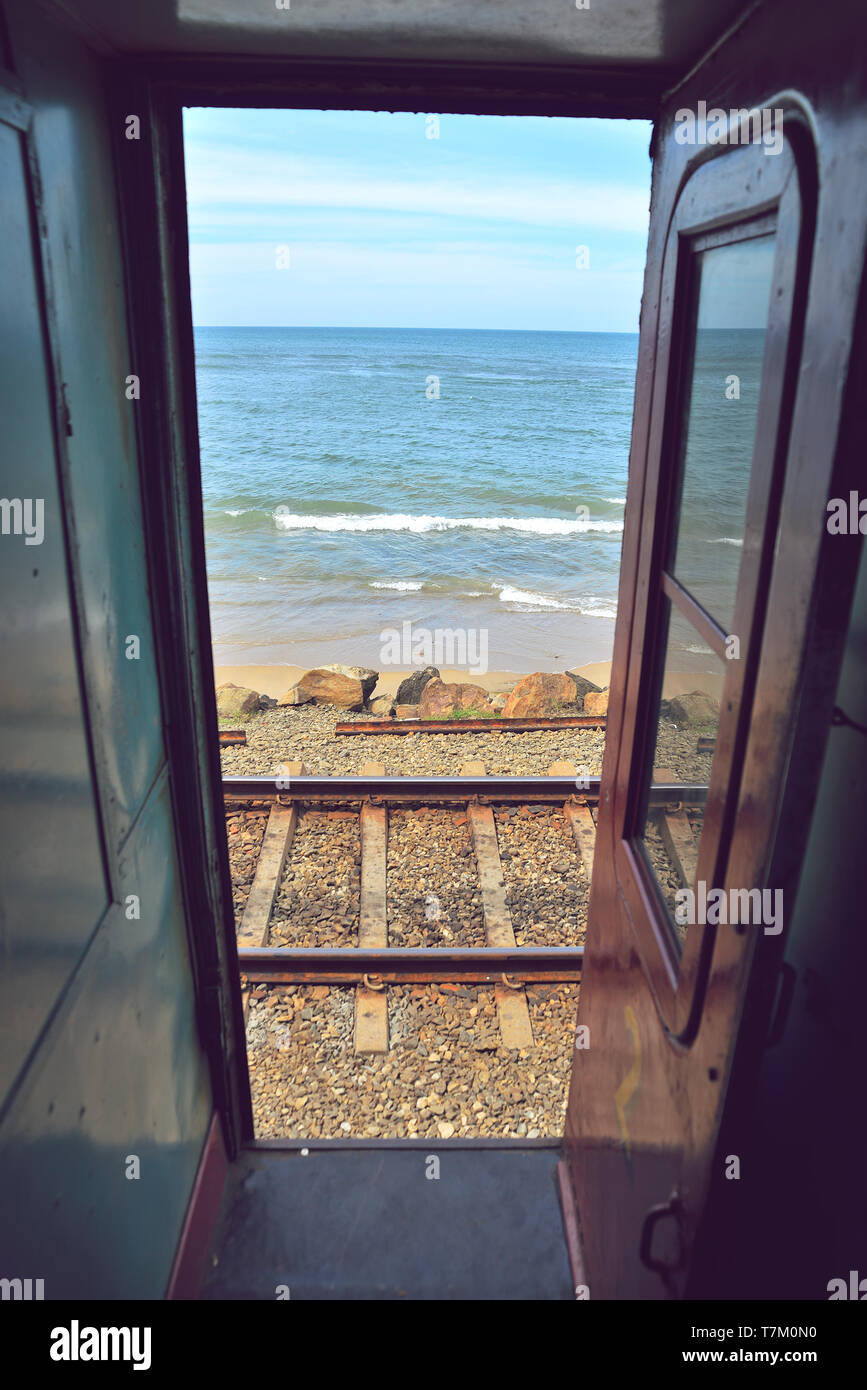 train rides along the the ocean shore Stock Photo - Alamy