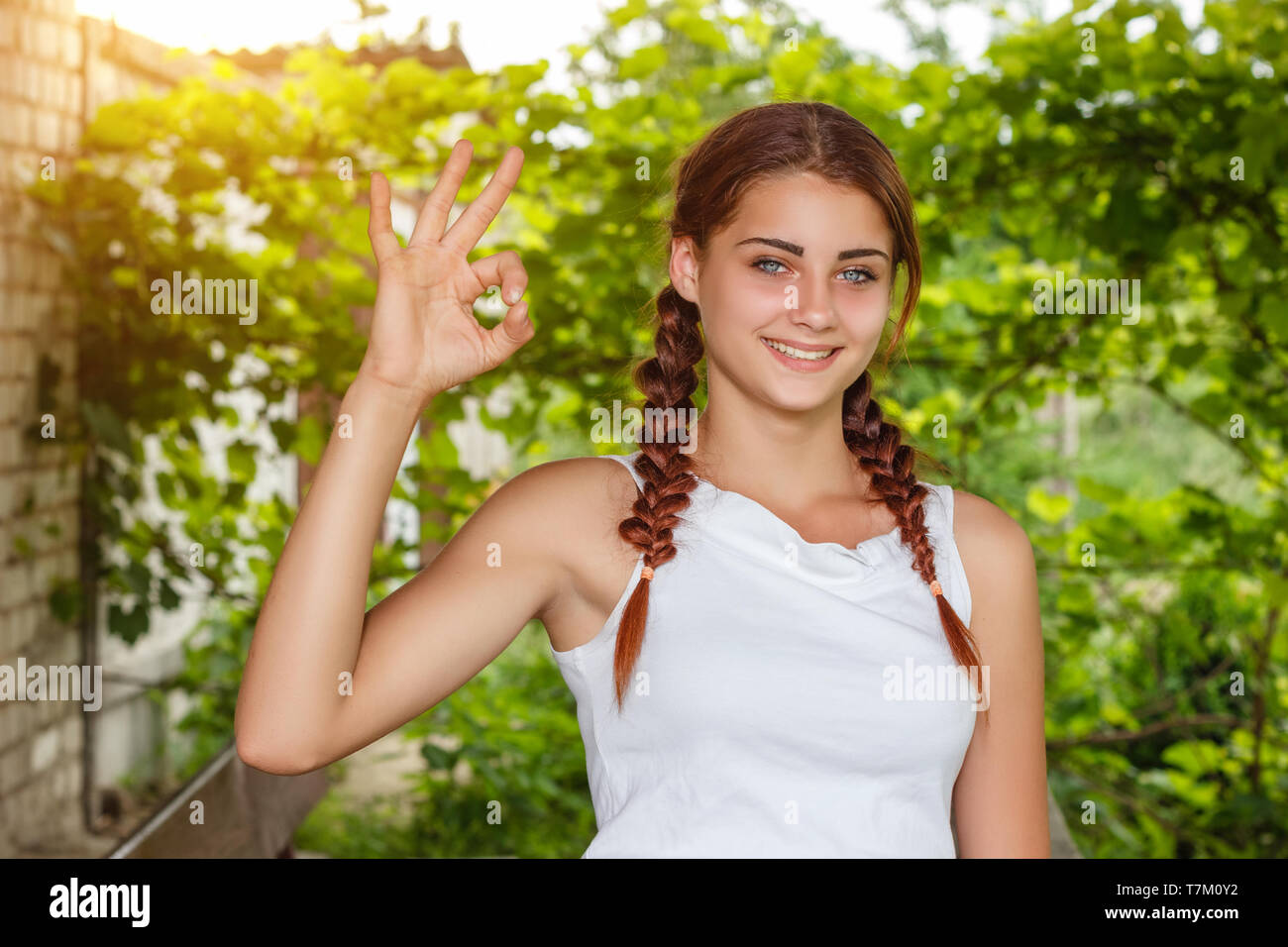 portrait of a happy girl in nature in the sun Stock Photo - Alamy