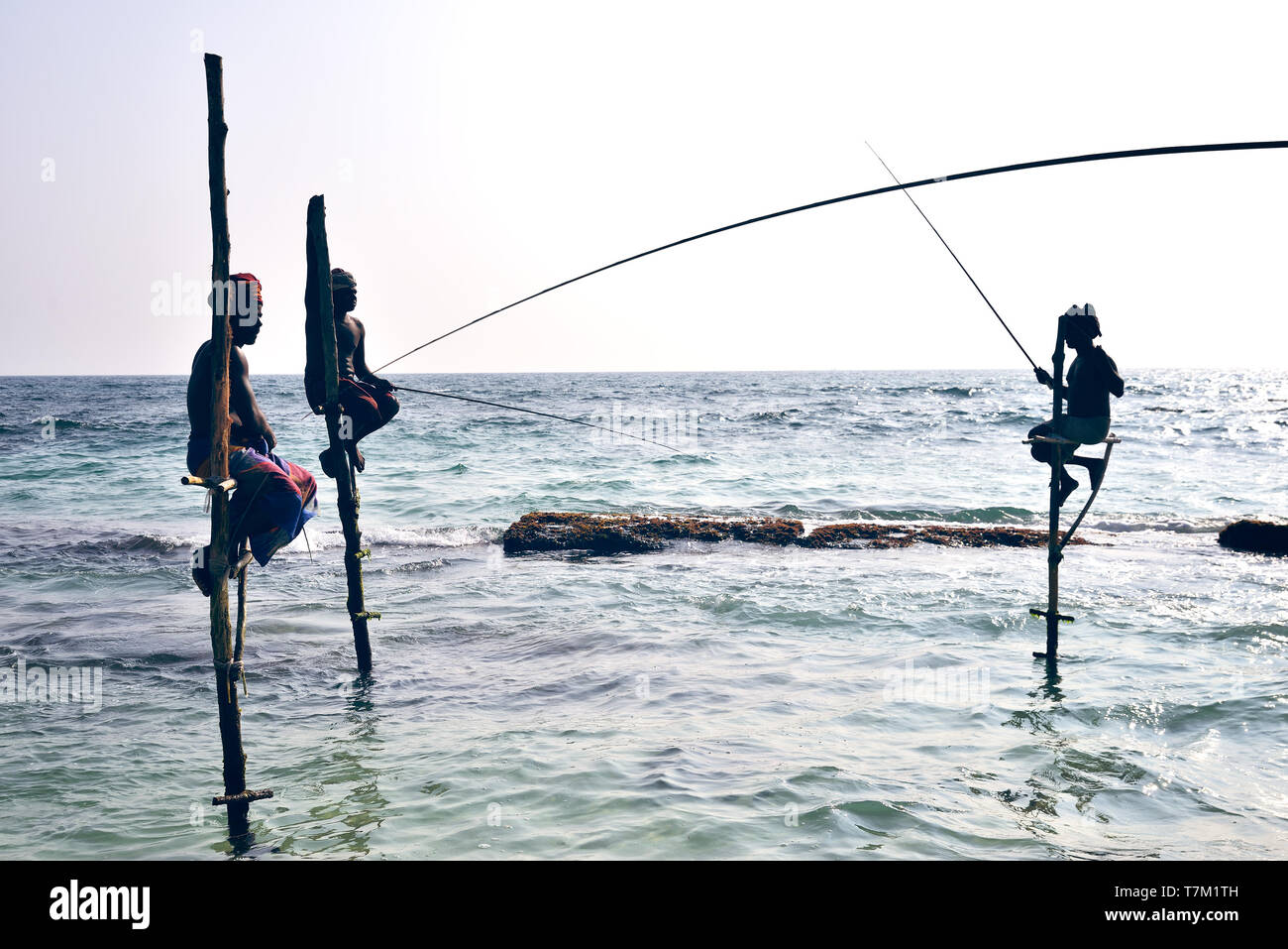The local fishermen are fishing in unique style Stock Photo - Alamy