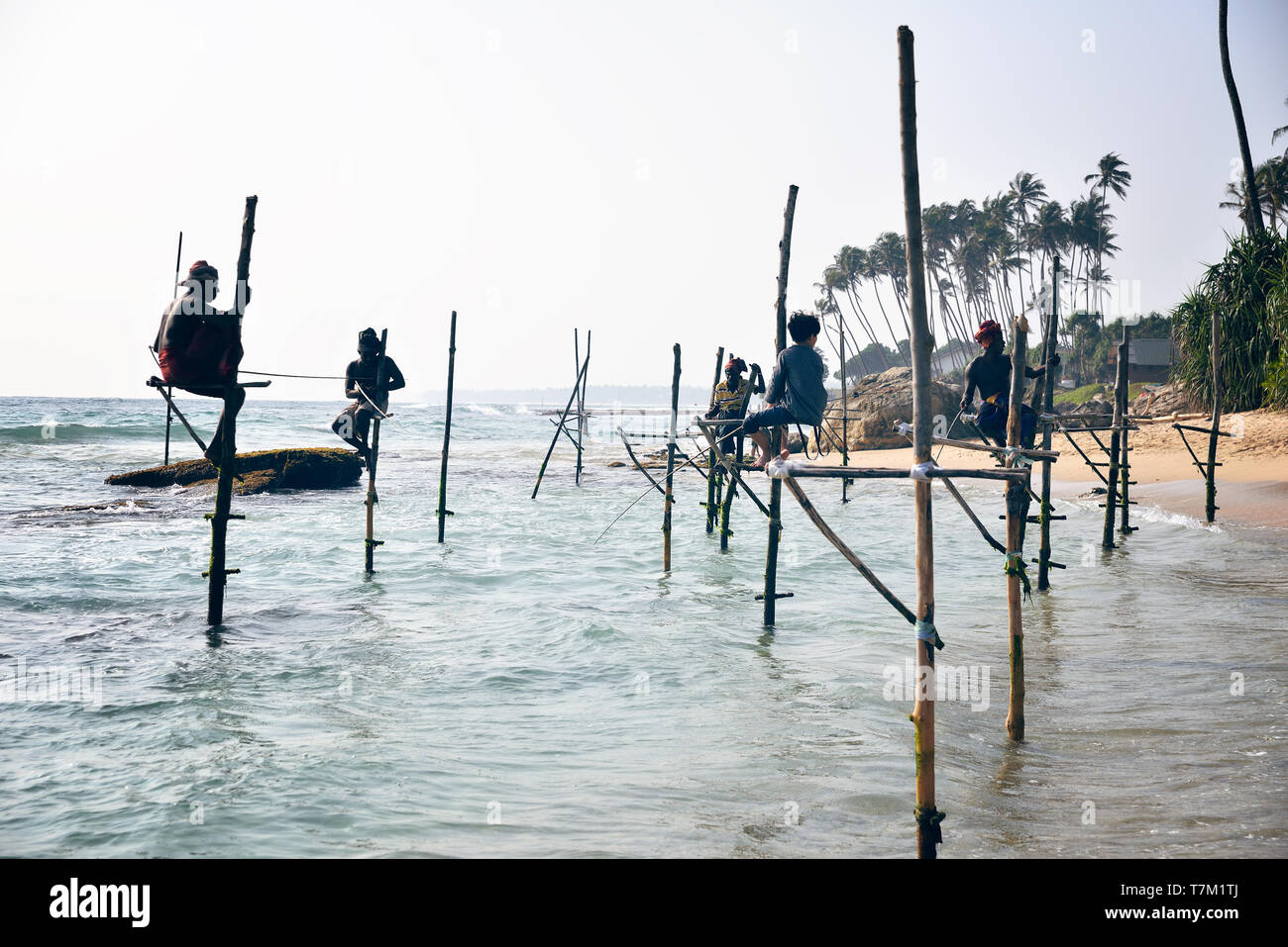 The local fishermen are fishing in unique style Stock Photo - Alamy
