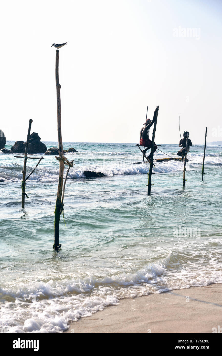 The local fishermen are fishing in unique style Stock Photo - Alamy
