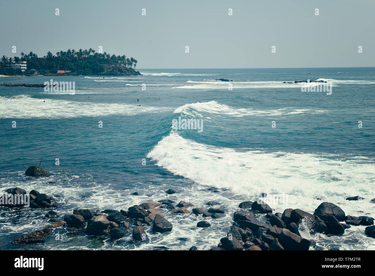 Tropical ocean shore large stones hi-res stock photography and images ...
