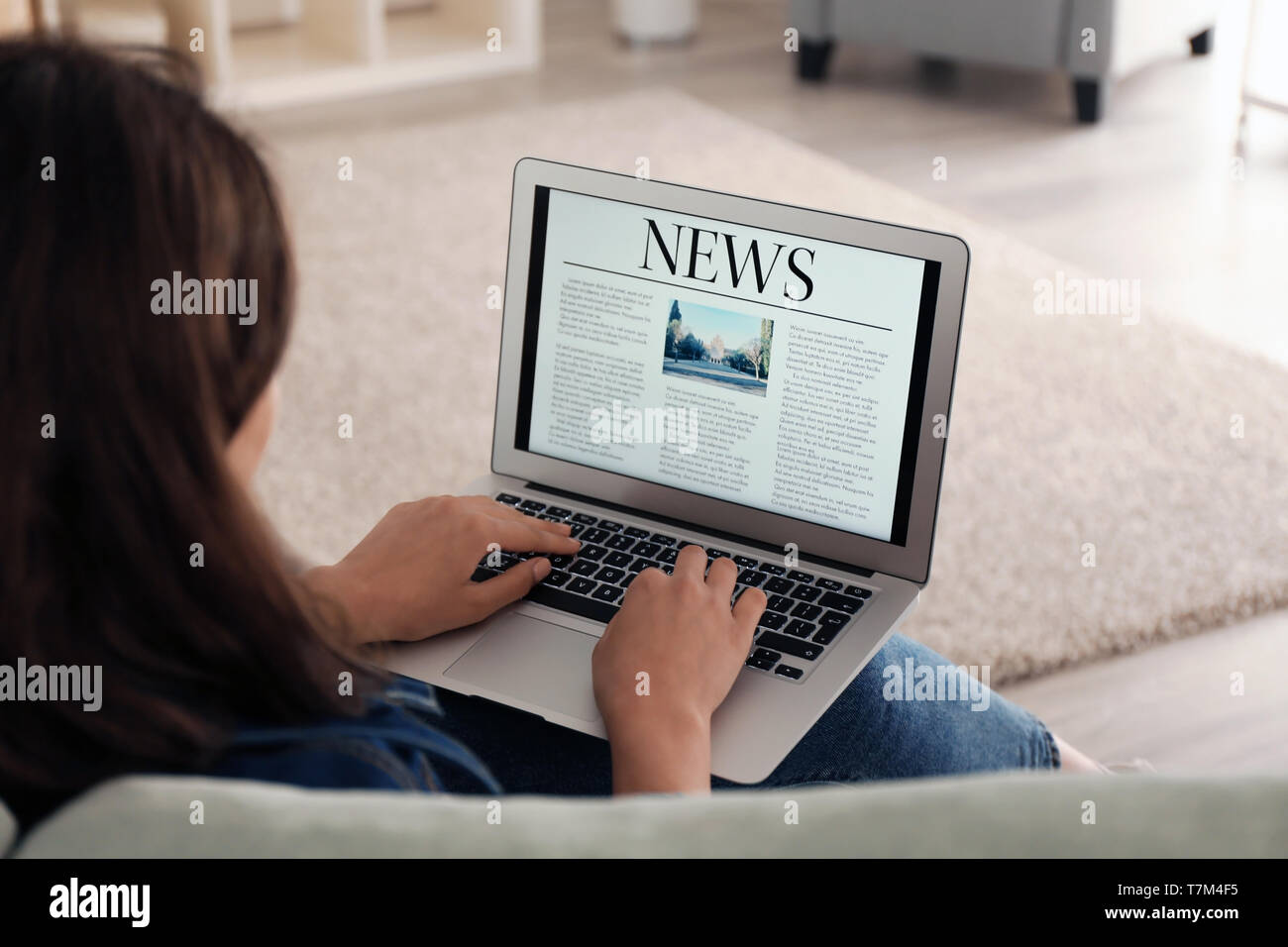 Laptop news lap sitting hi-res stock photography and images - Alamy