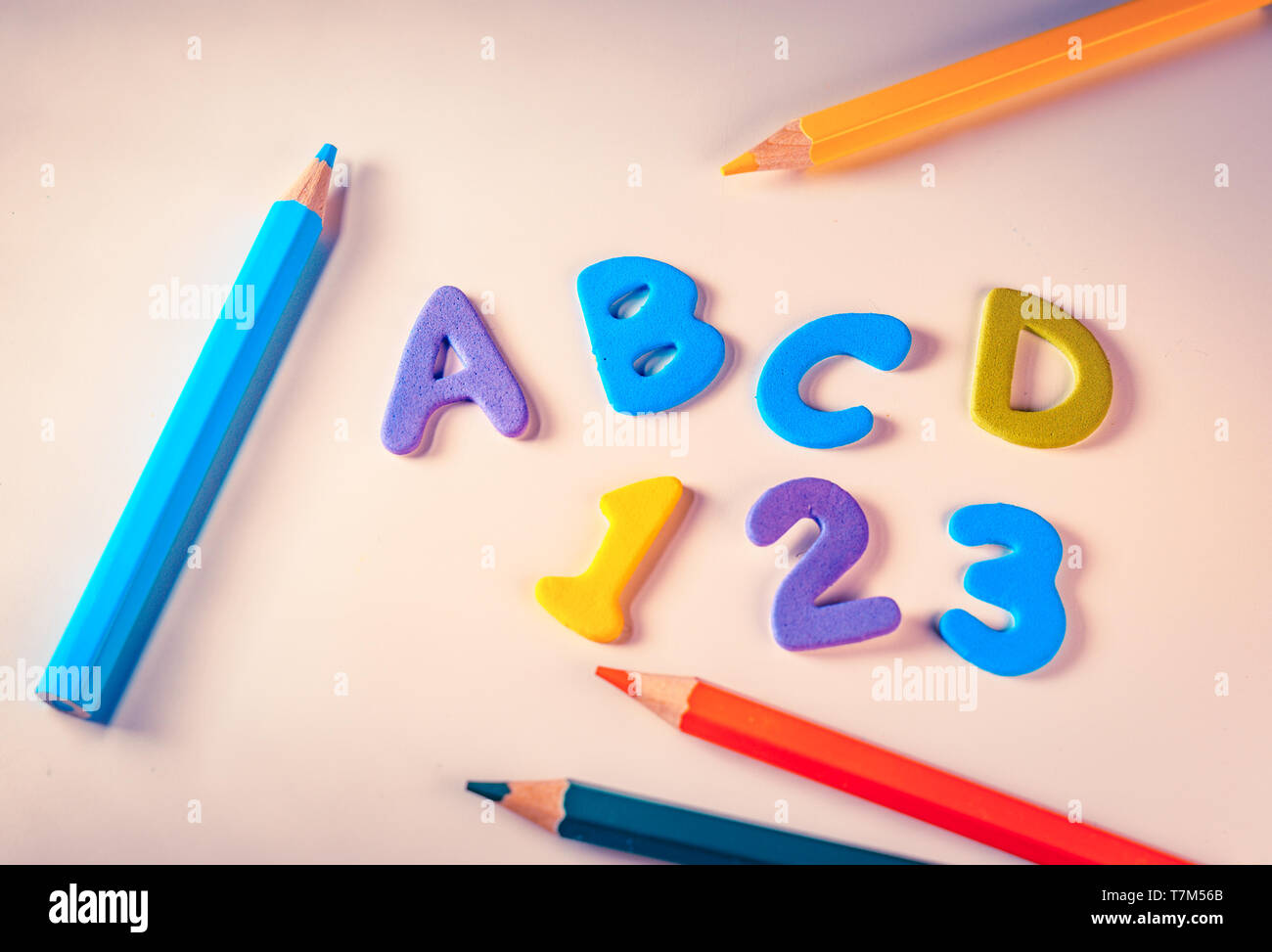Alphabet letters and numbers over a kid's desk Stock Photo - Alamy