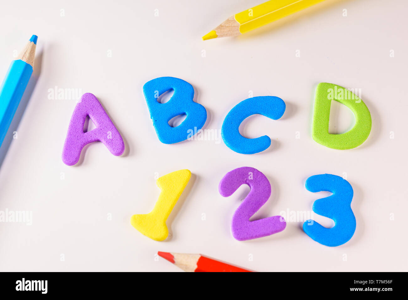 Alphabet letters and numbers over a kid's desk Stock Photo - Alamy