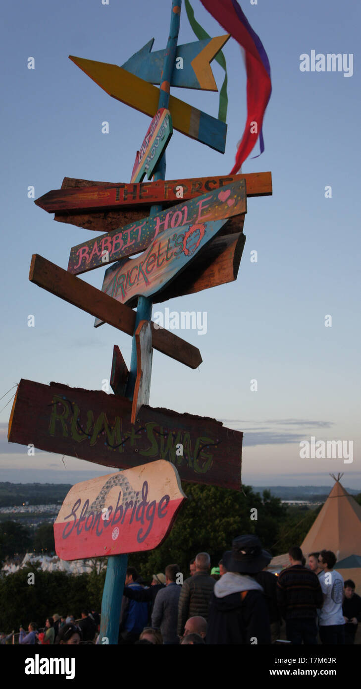 Glastonbury festival signs Stock Photo - Alamy