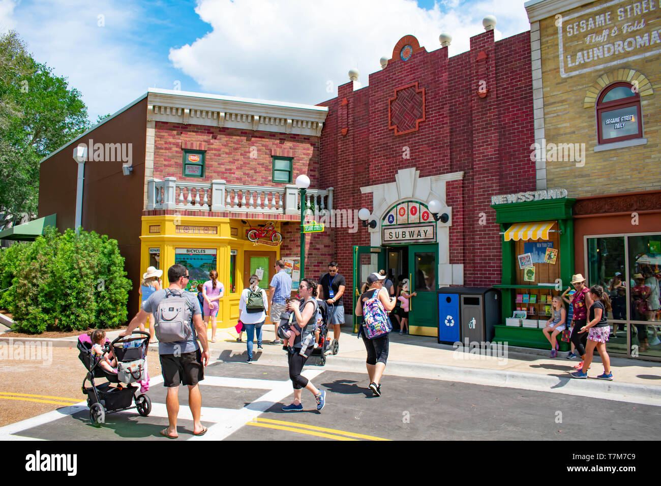 Orlando, Florida. April 7, 2019. People walking in colorful Sesame ...