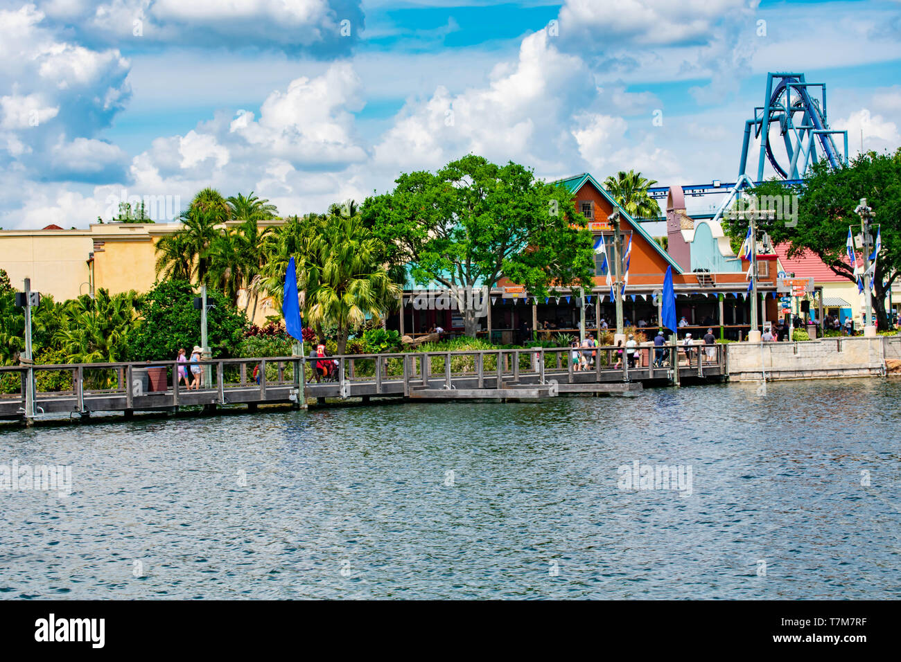 Orlando, Florida. April 7, 2019. People walking on wood bridge . View ...