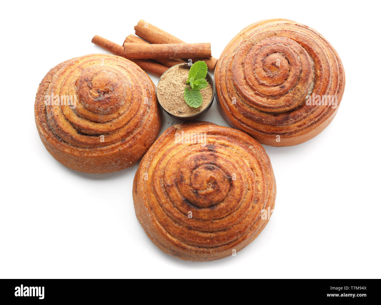 Sweet cinnamon buns on white background Stock Photo - Alamy