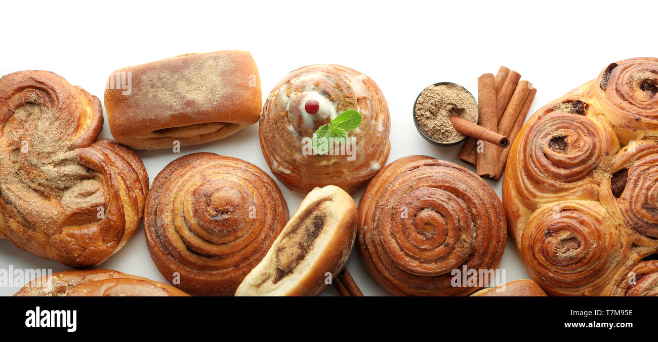 Sweet cinnamon buns on white background Stock Photo - Alamy