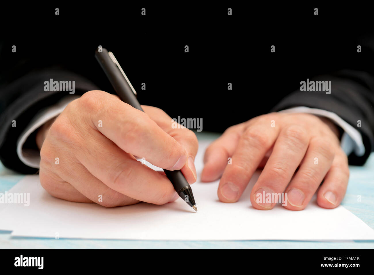 Mans hand signing document hi-res stock photography and images - Alamy