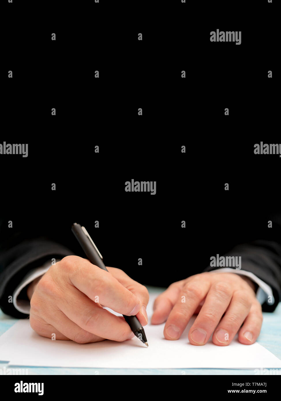 Mans hand signing document hi-res stock photography and images - Alamy
