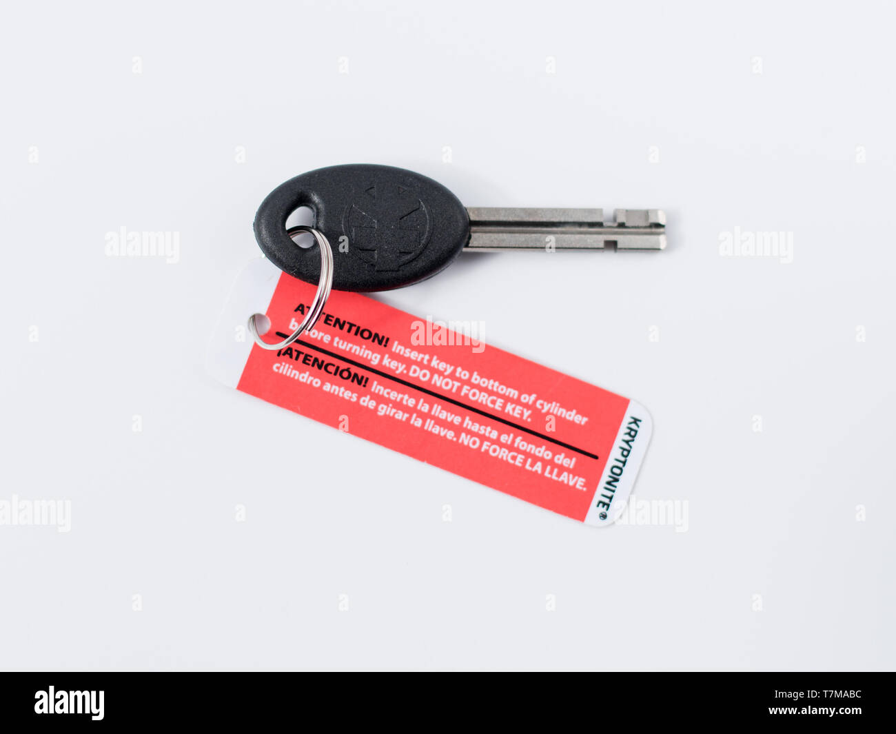 Bicycle lock key with key tag Stock Photo - Alamy
