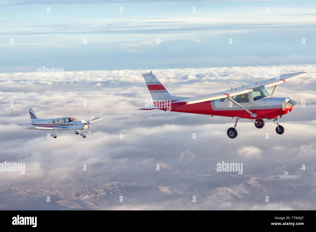 Small single engine airplane flying in the gorgeous sunset sky through ...