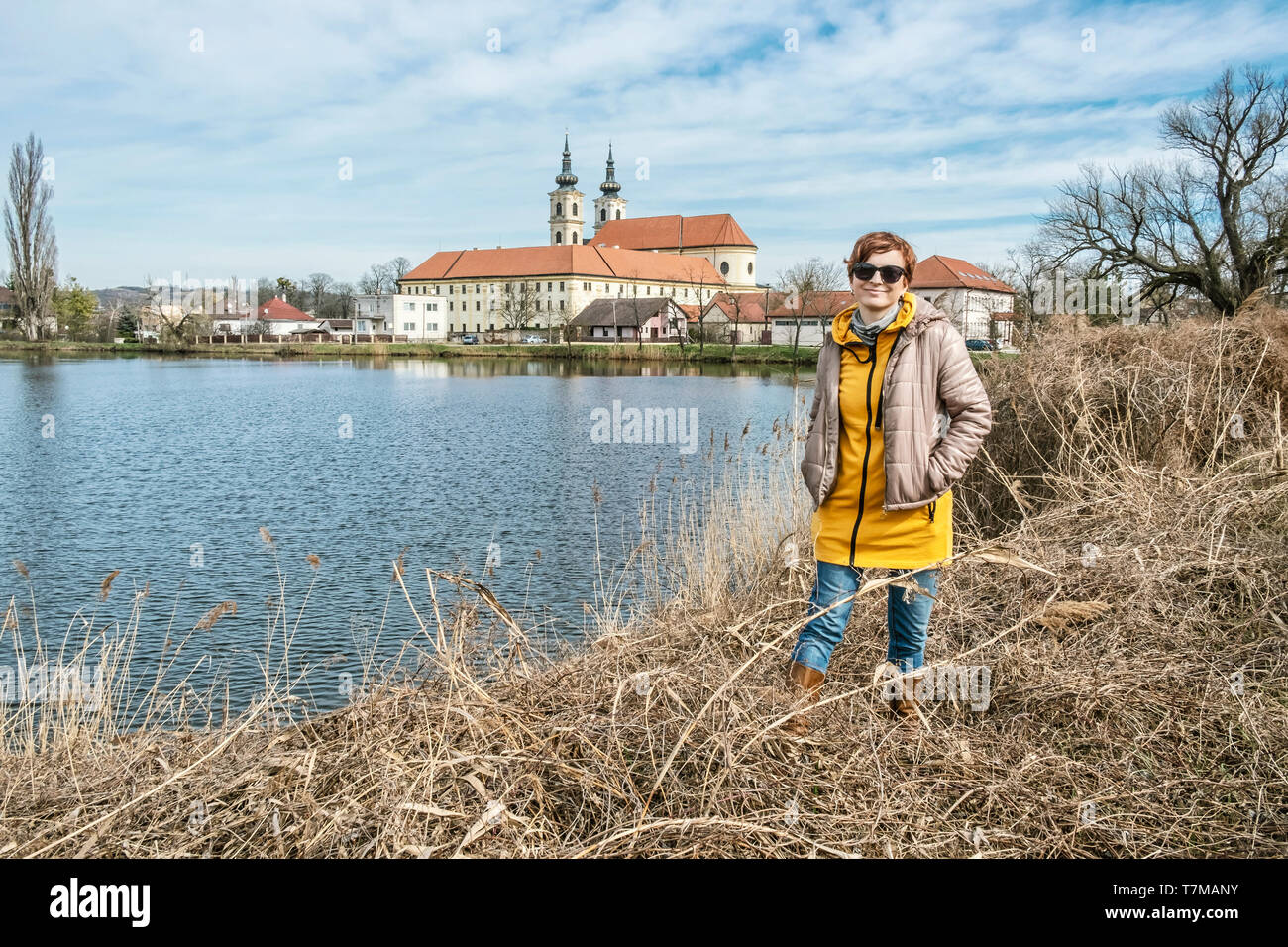 Tourist woman posing with Basilica minor in Sastin-Straze, Slovak ...