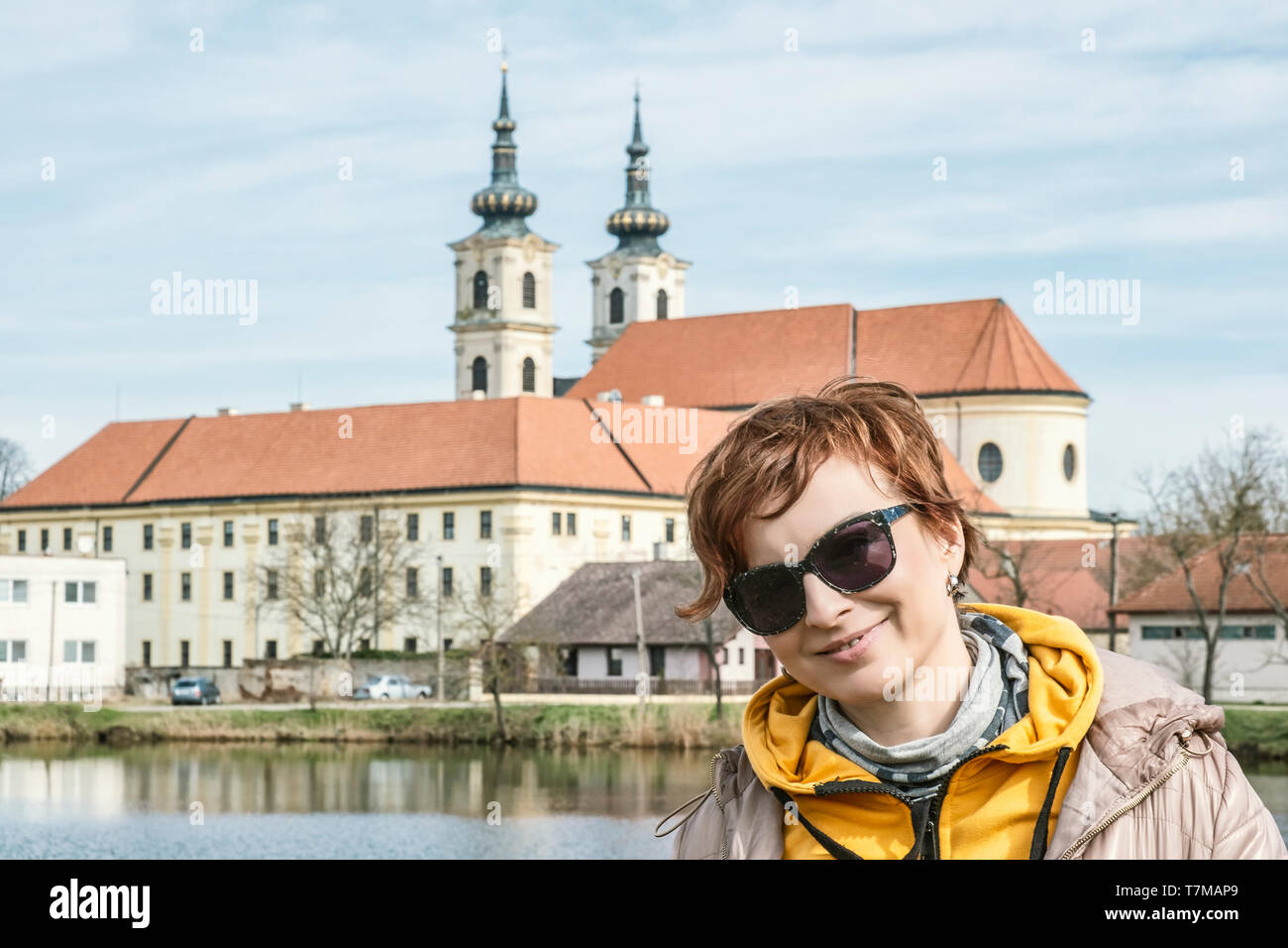 Tourist woman posing with Basilica minor in Sastin-Straze, Slovak ...