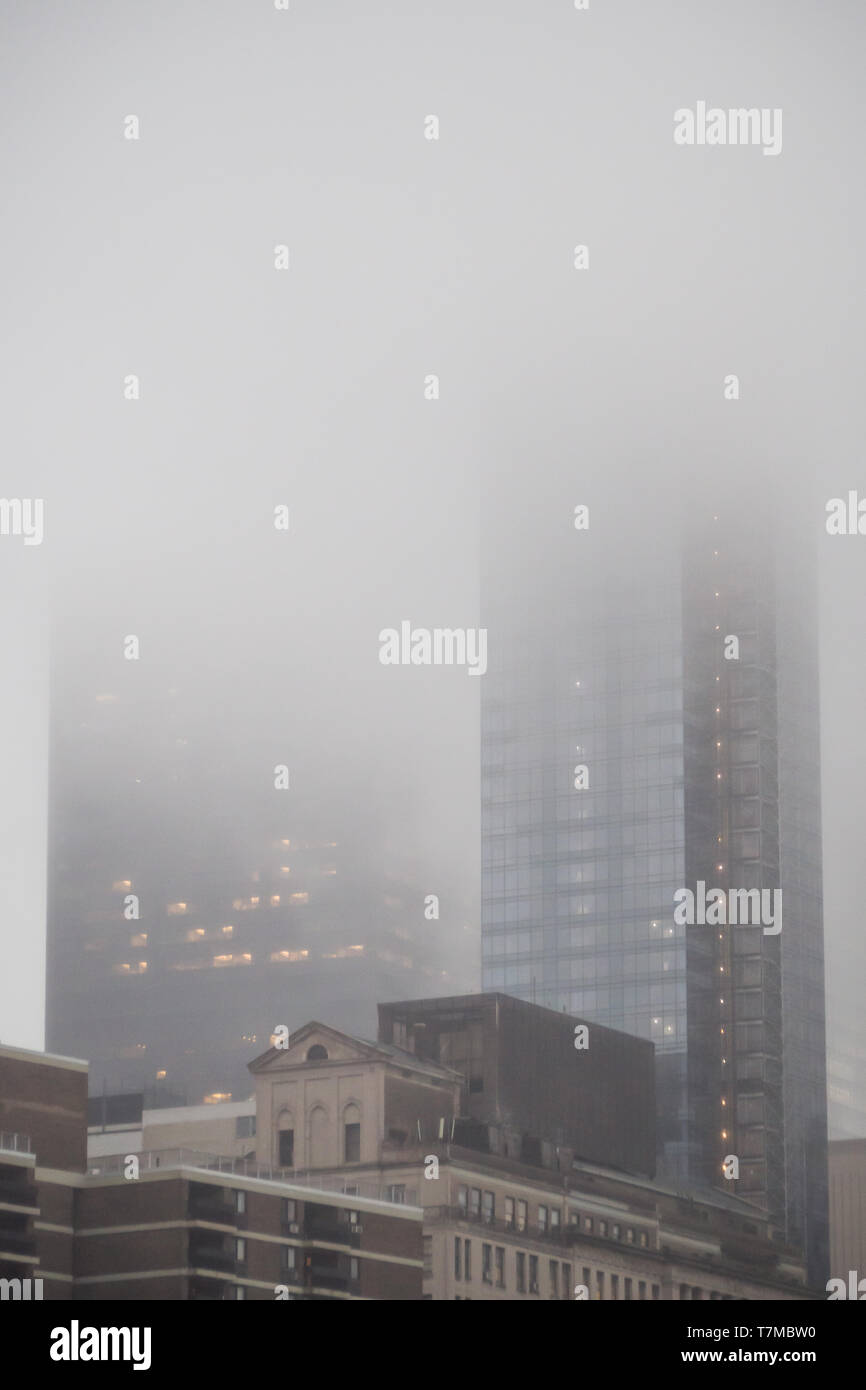 Skyscrapers lost in mist and clouds in New York Stock Photo - Alamy