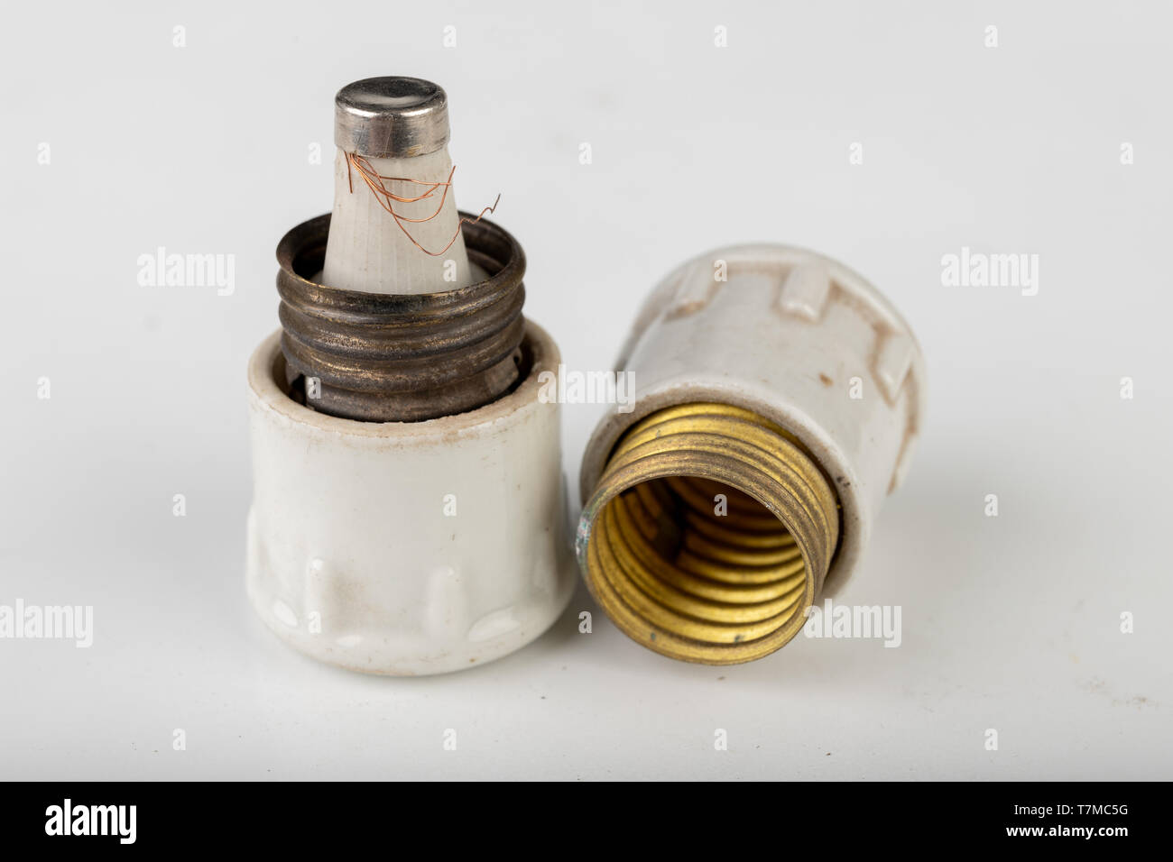 Old ceramic electric fuse. Blown and badly repaired security for energy ...