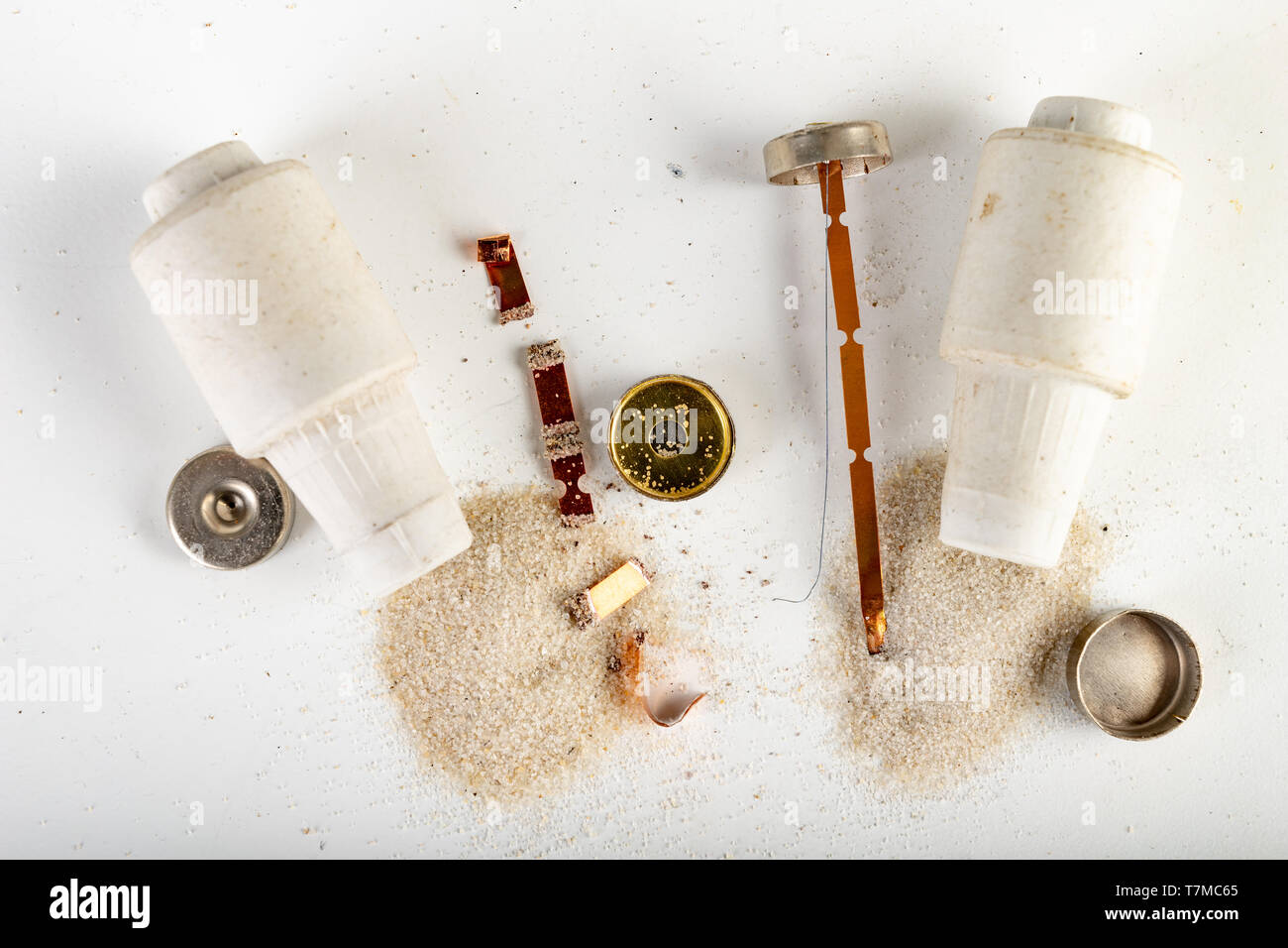 Old ceramic electric fuse. Blown and badly repaired security for energy ...