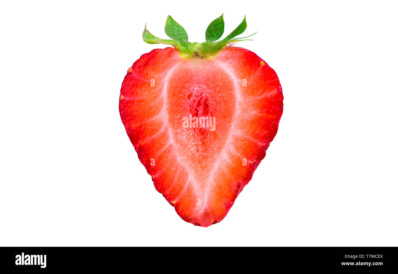 Single strawberry halves isolated on white background Stock Photo - Alamy