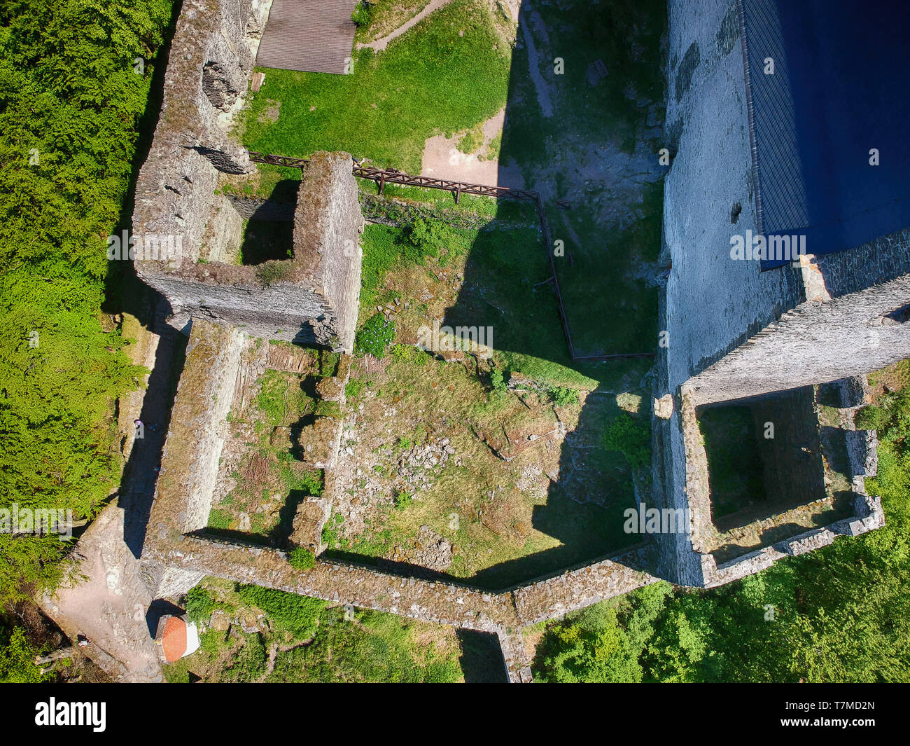 The tower of stone castle Bezdez on the hill with blue sky Stock Photo ...