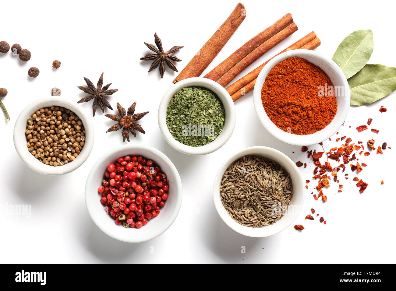 Bowls with various spices on white background Stock Photo - Alamy