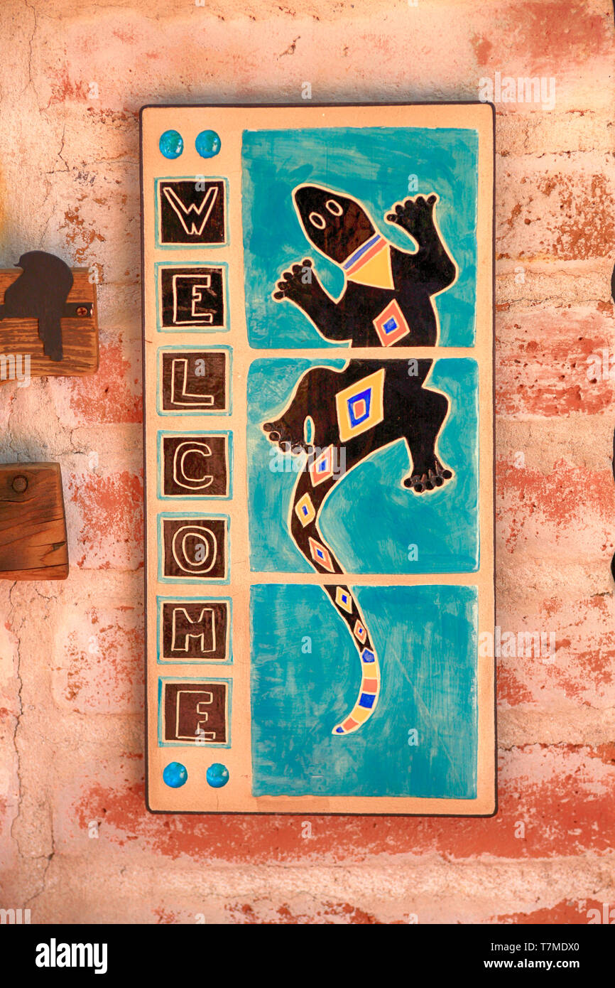 Welcome sign on a building wall depicting one the many different ...