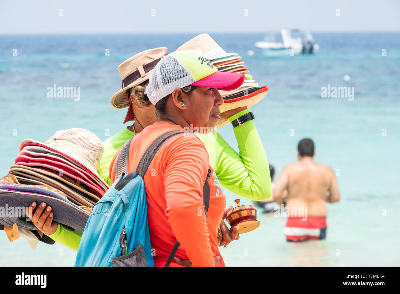 Local beach vendors selling their wares to tourists in West Bay Roatan ...