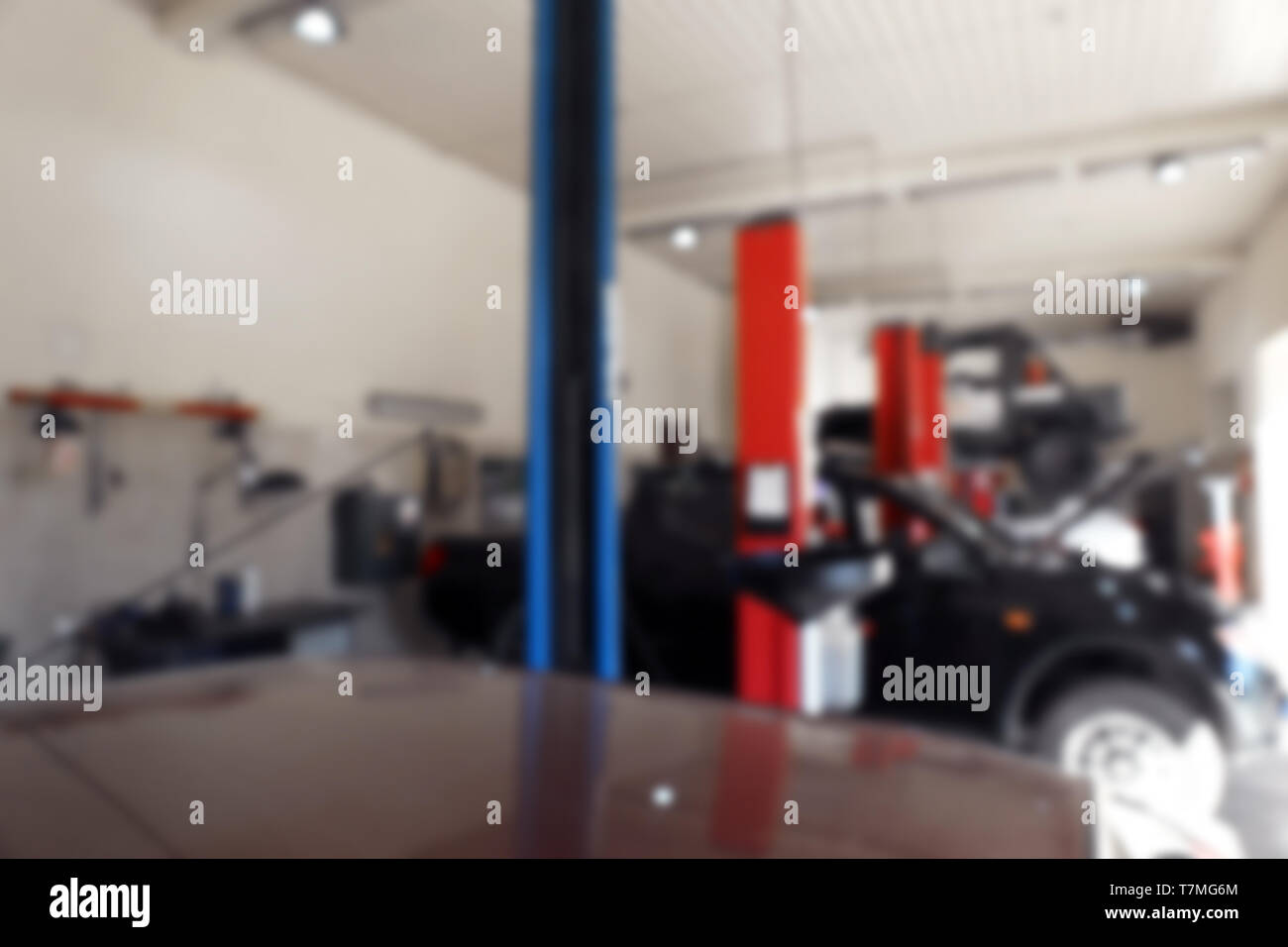 Blurred view of car service center Stock Photo - Alamy
