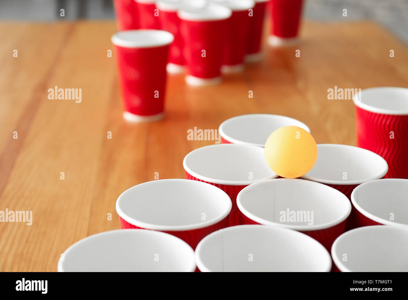 Set for beer pong game on table, closeup Stock Photo - Alamy