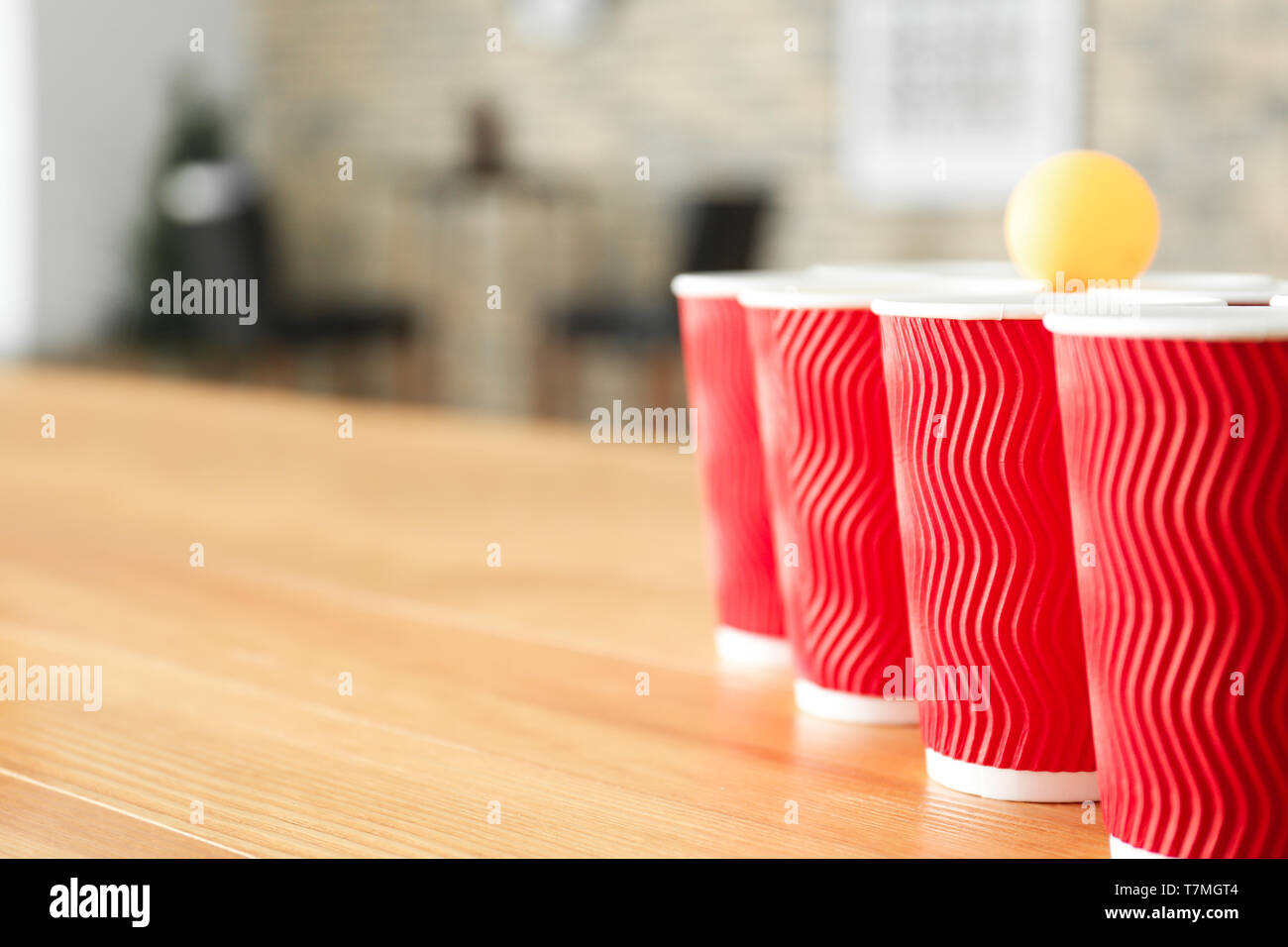 Set for beer pong game on table Stock Photo - Alamy