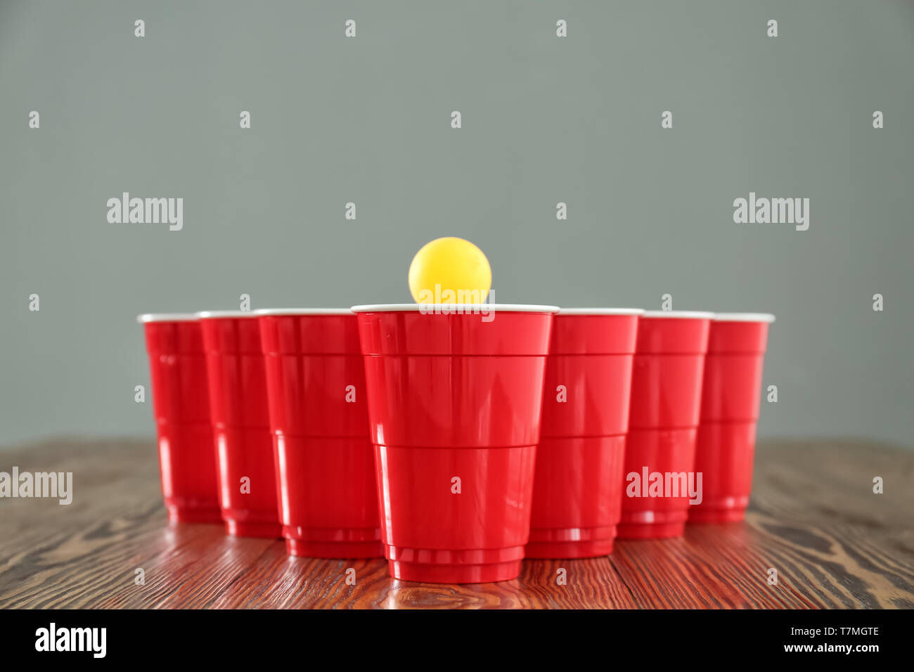 Set for beer pong game on table Stock Photo - Alamy