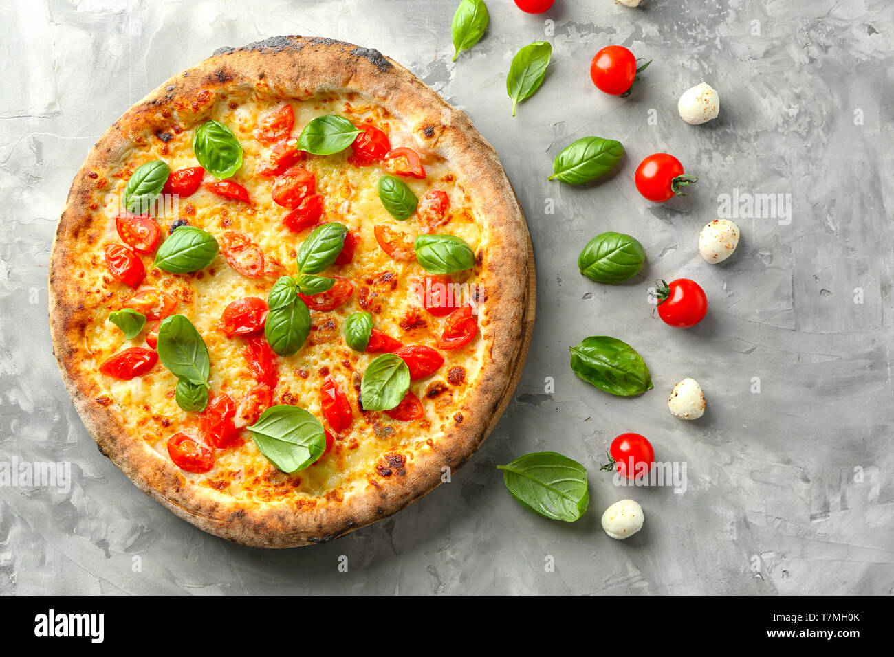 Delicious pizza on grey background Stock Photo - Alamy
