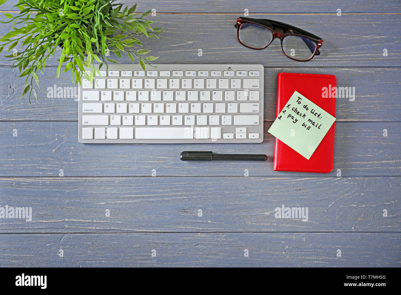 To-do list with computer keyboard on wooden background Stock Photo - Alamy