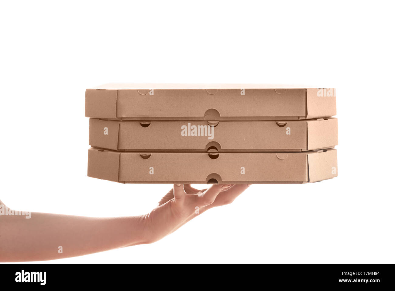 Hand of delivery woman with cardboard pizza boxes on white background ...