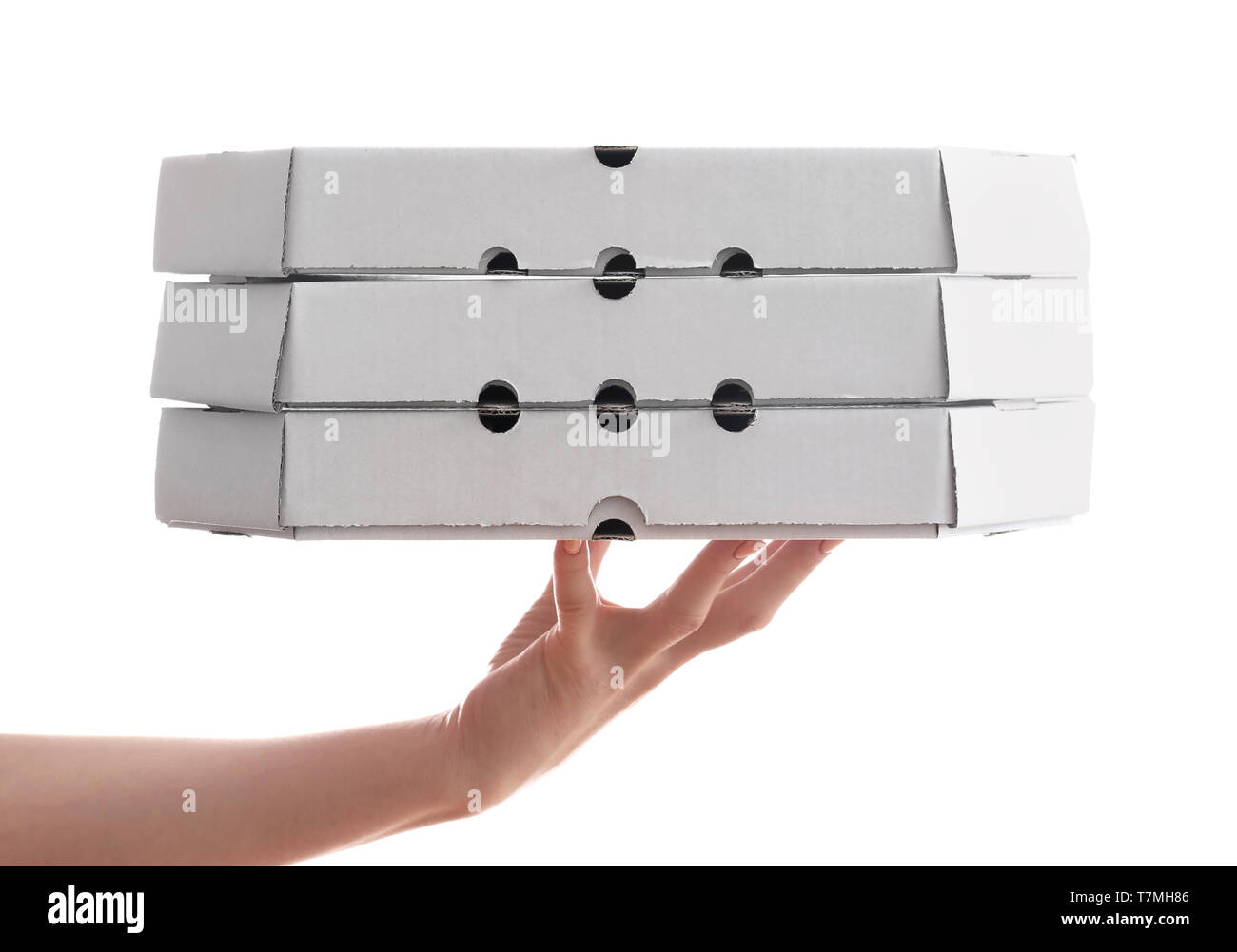 Hand of delivery woman with cardboard pizza boxes on white background ...