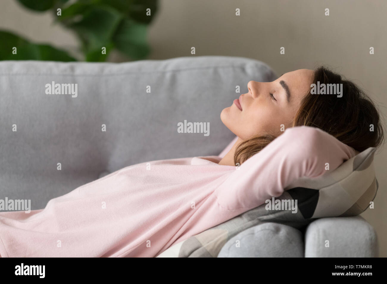 Side close up view woman having day nap on couch Stock Photo - Alamy