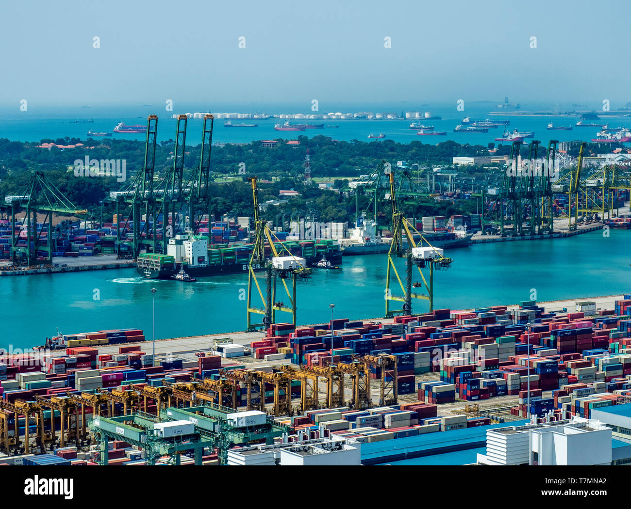 Cranes and shipping containers at Port of Singapore at Keppel Harbour ...