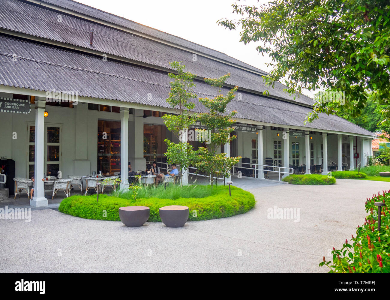 Tables and chairs set up for alfresco dining at a colonial building in ...