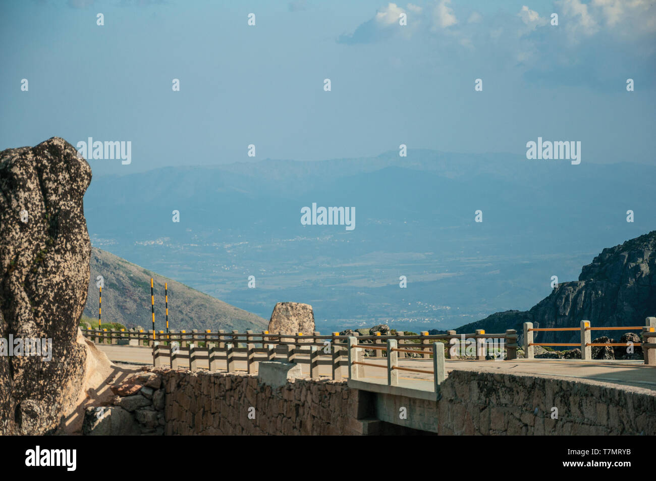 Deserted bridge with parapet of concrete on hilly landscape at the ...