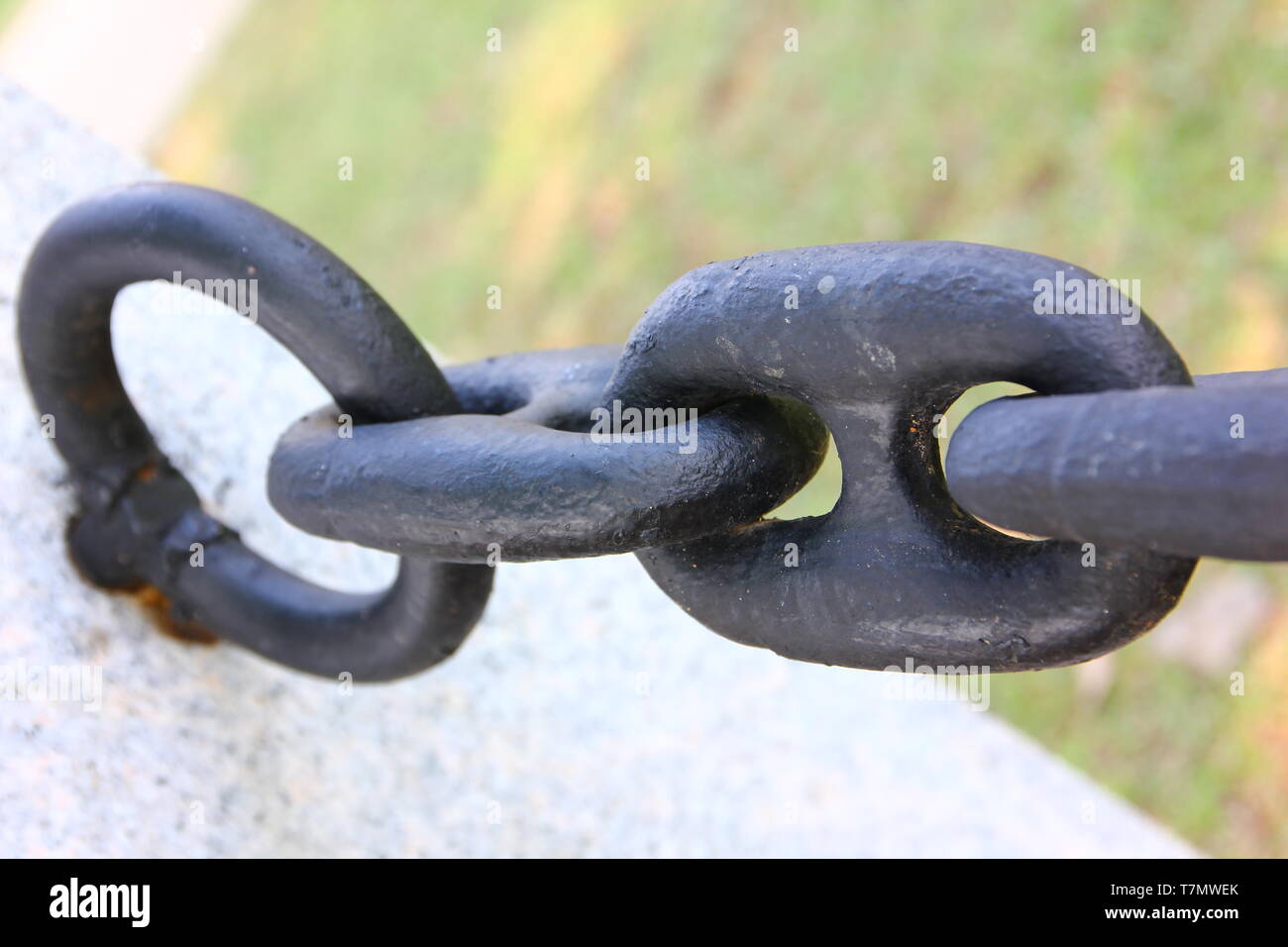 black iron chain with cement pole Stock Photo - Alamy