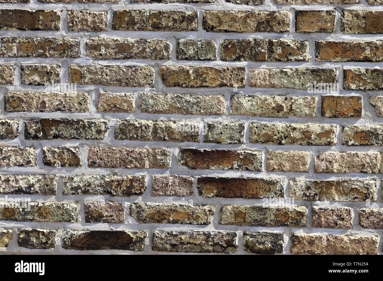 Detailed close up of colorful aged and weathered brickwall in high ...