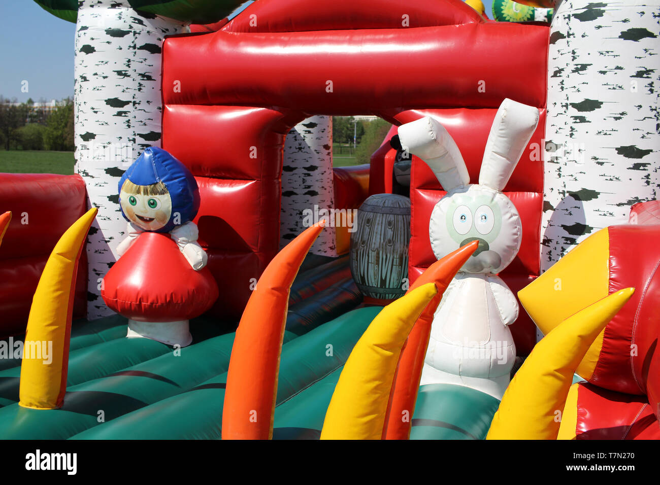 Inflatable colorful trampoline for children. Jump to children in a ...