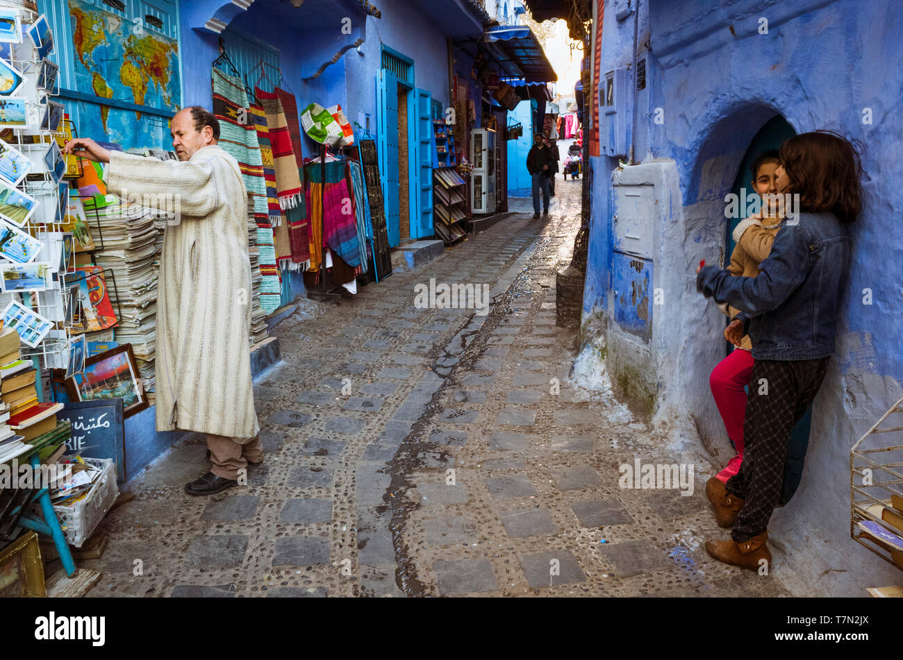 Chefchaouen, Morocco : Street scene with people in the blue-washed ...