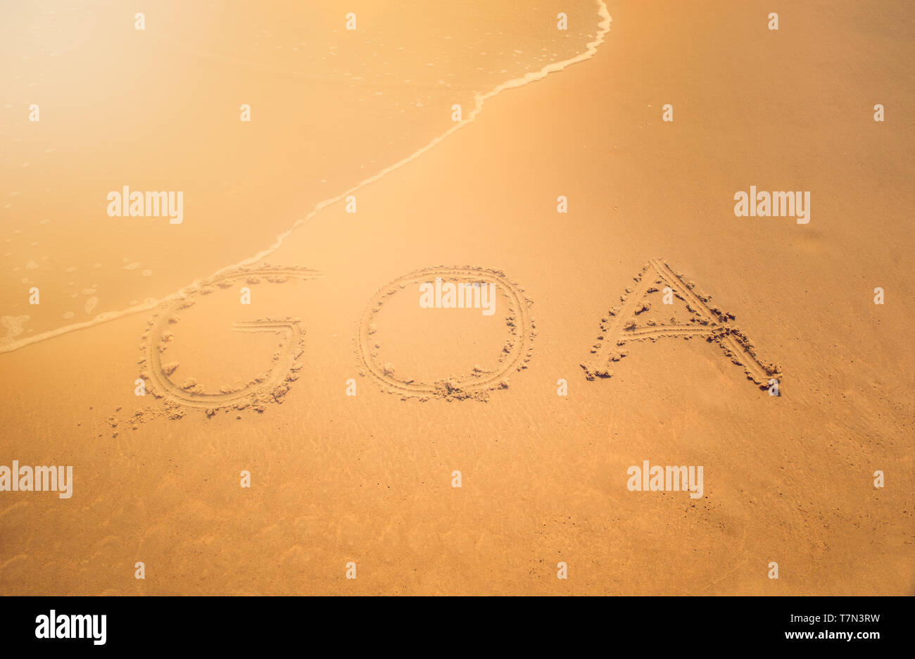 Finger drawn on the sand word Goa, South India Stock Photo - Alamy